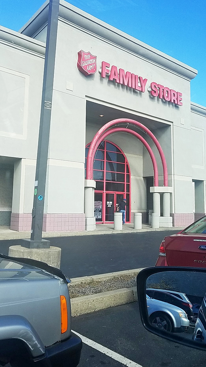 The red arched entrance welcomes bargain hunters like a portal to a thrifty alternate dimension.