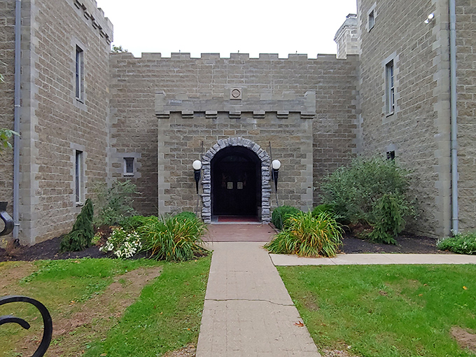 The grand entrance says "drawbridge not included," but the stone archway and crenellated walls make you half-expect a knight to request your royal credentials.