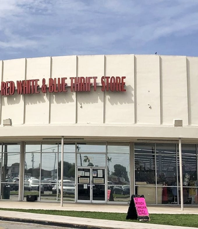 Bold red letters announce your arrival at bargain paradise. That neon-pink sign hints at today's special deals waiting just beyond those glass doors.