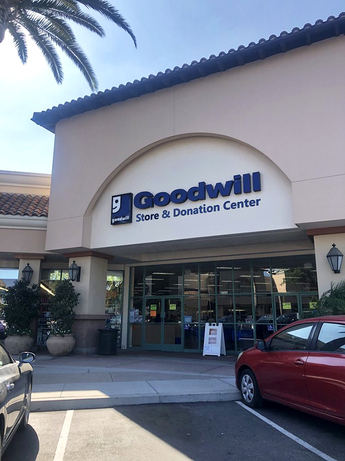 The entrance beckons like a portal to treasure hunting adventures. That Mediterranean-inspired archway has welcomed countless bargain seekers into its air-conditioned embrace.