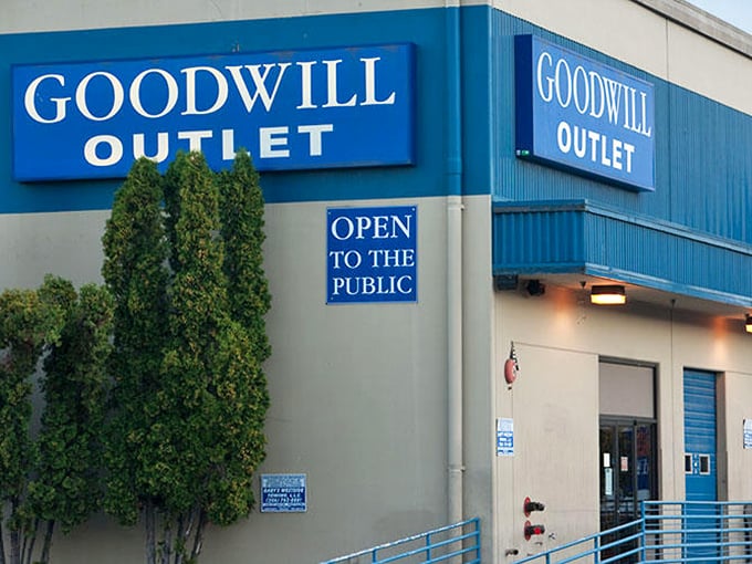 Bold blue signage welcomes bargain hunters to this no-frills shopping adventure. The "Open to the Public" sign might as well read "Abandon retail prices, all ye who enter here."