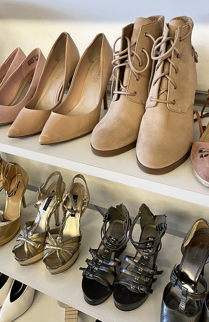 These shelves hold more potential than a library card&mdash;designer heels waiting for their Cinderella moment.