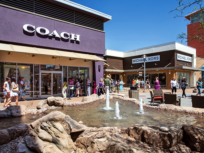 Water features and desert stone create an oasis between Coach and Michael Kors, where shoppers pause to rest weary feet and contemplate their next retail conquest.