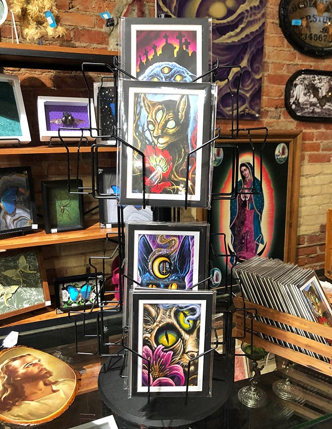 Where mystical meets artistic: This rotating display of otherworldly art prints transforms shopping into a gallery experience. That cat-eyed creature seems to follow you around the store!