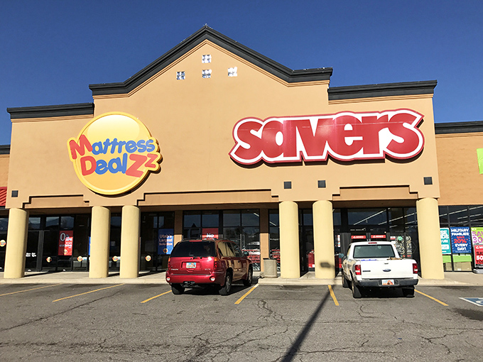 The bold red Savers sign stands out against the Utah sky, a lighthouse guiding bargain hunters to safe harbor.