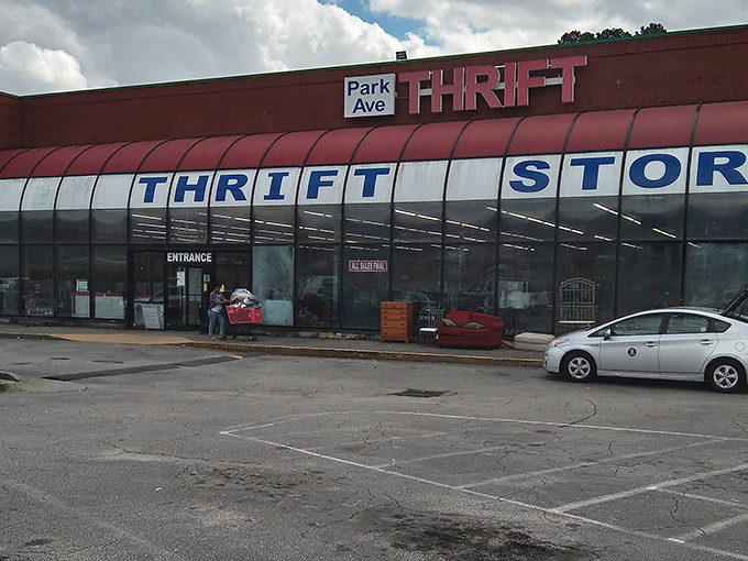 That distinctive curved glass storefront isn't just for show—it's practically a portal to an alternate dimension where designer labels don't require a second mortgage.