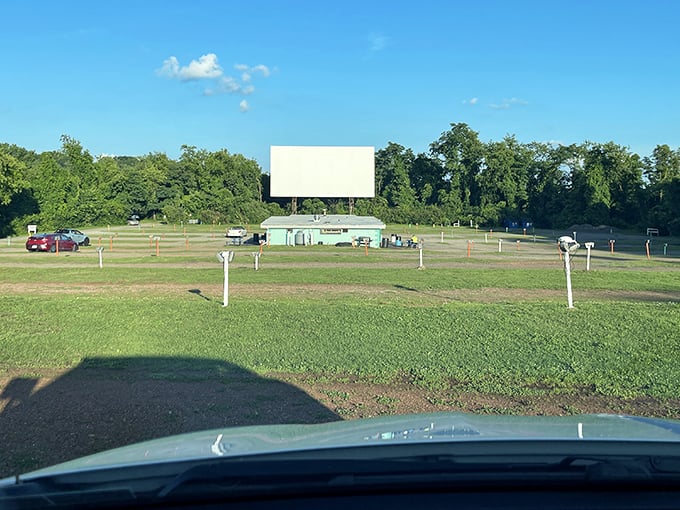 The classic white screen stands sentinel against blue skies, patiently waiting for dusk to transform it into a portal to other worlds.