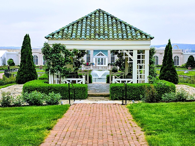 This elegant gazebo isn't just garden architecture&mdash;it's where plants go to get married. The green-tiled roof practically winks at you in the sunlight.
