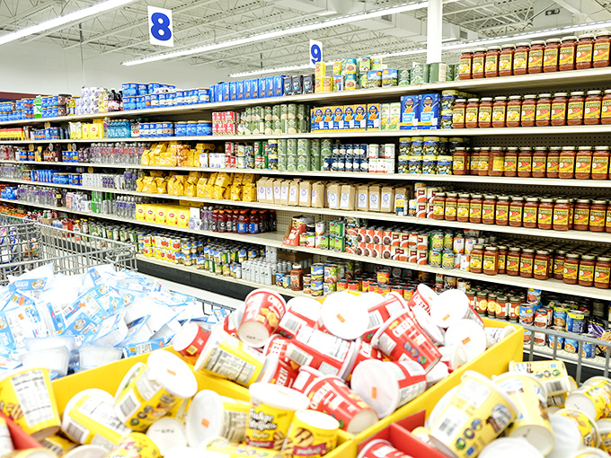 Paper products stacked with military precision. The toilet paper fortress that would make any pandemic panic-buyer weep with joy. 