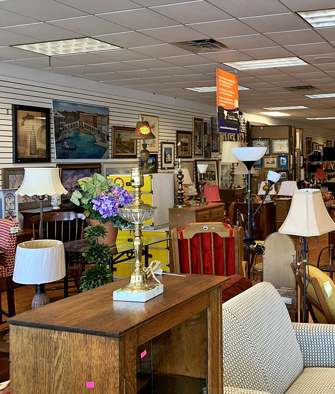 Furniture heaven awaits! Vintage lamps, solid wood tables, and framed artwork create living room vignettes that whisper, "Your home could look this interesting for a fraction of retail prices."