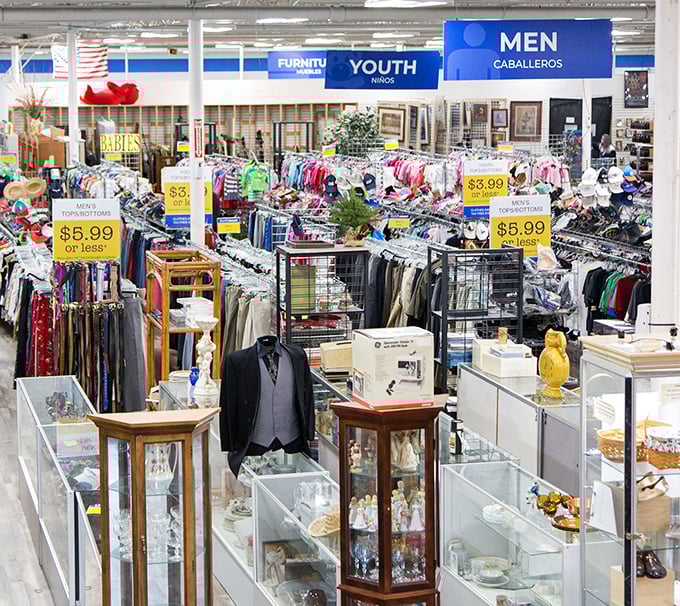 Organized chaos at its finest! Color-coded sections and clear signage make this thrift store feel more like a department store's quirky cousin.
