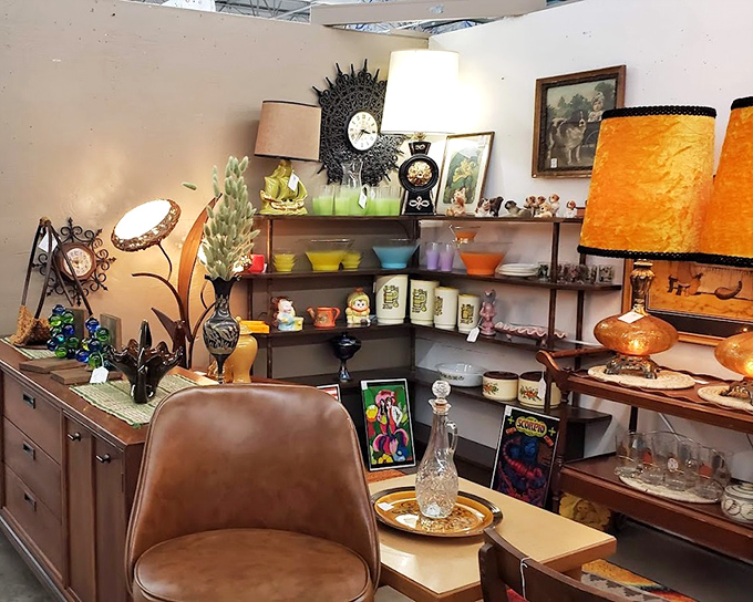 Mid-century modern meets colorful kitsch in this perfectly curated booth. That orange lampshade is practically begging to illuminate your next dinner party.