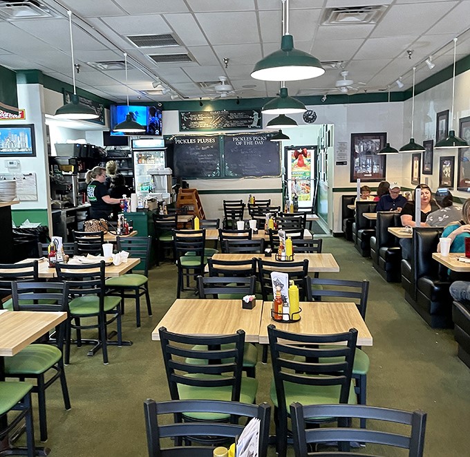Inside, the no-frills dining room feels like a time capsule of authentic deli culture&mdash;where conversations hum as pleasantly as the refrigerator cases.