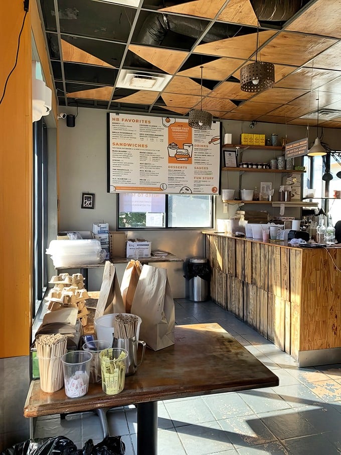 Inside, rustic wooden counters and a checkerboard ceiling create the perfect backdrop for biscuit magic. Simplicity never looked so appetizing.