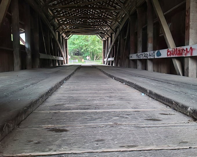 Walking these worn planks feels like strolling through history's hallway, each wooden beam telling stories of travelers past.