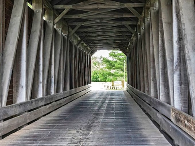 Step inside and witness the geometric poetry of yesteryear's engineering. These wooden beams have witnessed over a century of crossings, whispers, and wanderers.