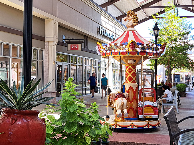The colorful carousel offers a moment of childhood joy amid the serious business of discount shopping. A welcome distraction for little shoppers.
