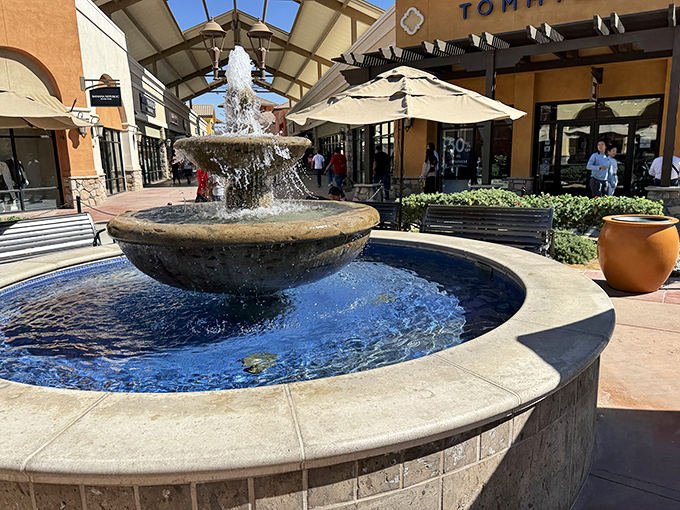 Spanish arches frame your shopping destiny while fountains whisper sweet promises of bargains yet to be discovered.