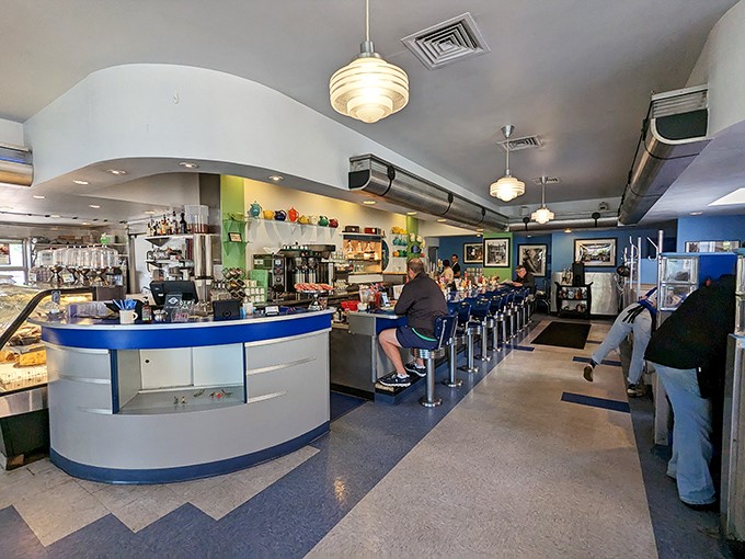 Step inside and the classic American diner dream comes to life—chrome counter stools, blue accents, and the promise of breakfast served all day.