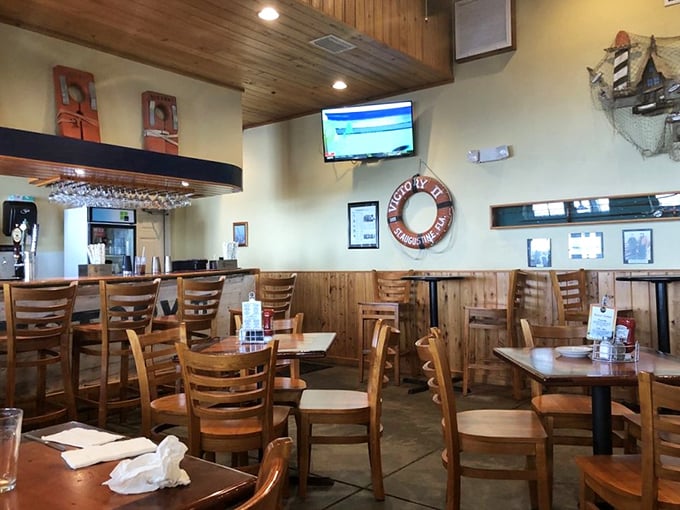 Nautical charm meets cozy comfort in this wood-paneled dining room where life preservers and fishing nets aren't just decor&mdash;they're a promise of seafood excellence.