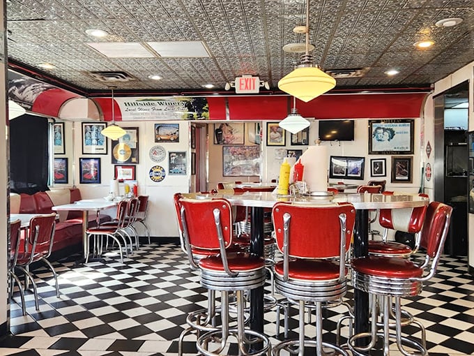 Red vinyl stools and checkerboard floors transport you straight to the 1950s. This isn't decoration&mdash;it's a portal to simpler times.