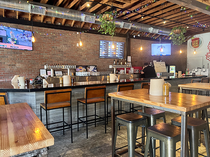 Industrial chic meets barbecue comfort &ndash; exposed brick, wooden tables, and hanging plants create the perfect backdrop for meat-induced euphoria.
