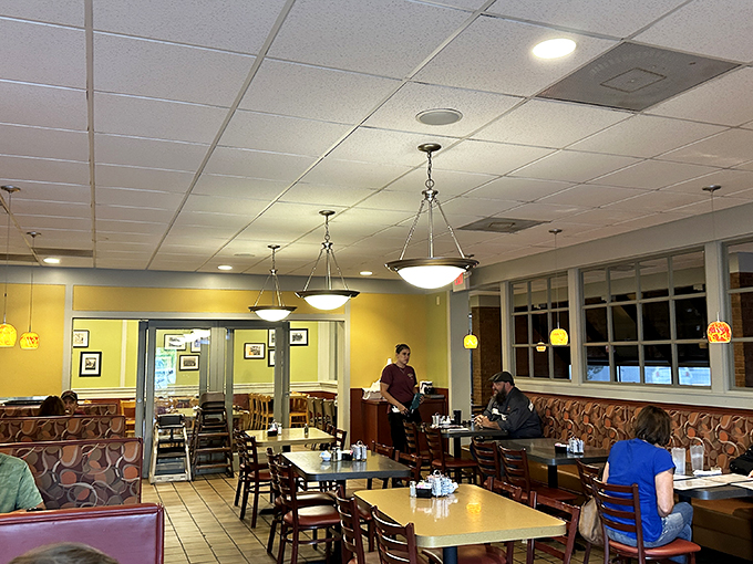 Warm yellow walls and pendant lighting create that perfect "welcome home" atmosphere where calories don't count and coffee refills are unlimited.