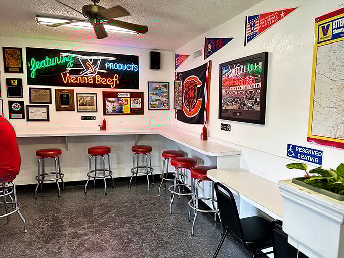 Red stools and Chicago memorabilia create the perfect backdrop for serious hot dog conversations.