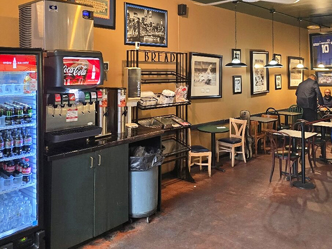 Inside, the golden walls and vintage photographs create a time capsule where sandwich artistry trumps interior design trends.