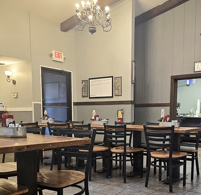 Rustic wooden beams meet elegant chandeliers in this cozy dining space. The perfect backdrop for comfort food conversations and cinnamon roll revelations.