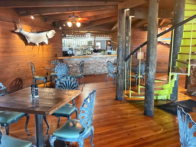 Shell-shaped chairs that would make Poseidon jealous surround a bar where maritime stories flow as freely as the cocktails.