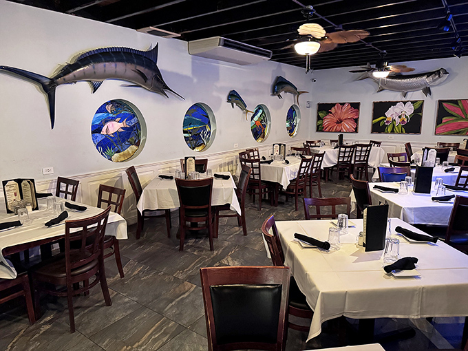 Mounted marlins and porthole windows transport you to a maritime wonderland, where white tablecloths promise a dining experience worth the drive.