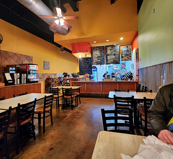 Step inside to a warm palette of yellows and oranges, where exposed ductwork meets comfort. This isn't Instagram-bait décor; it's authentically welcoming.