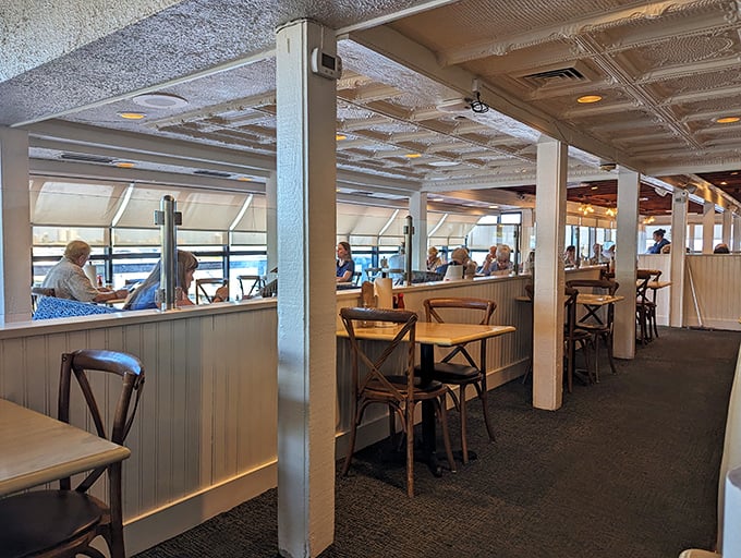 Cozy booths with river views create that perfect "I've discovered something special" feeling that makes you want to keep the place secret, yet tell everyone you know.