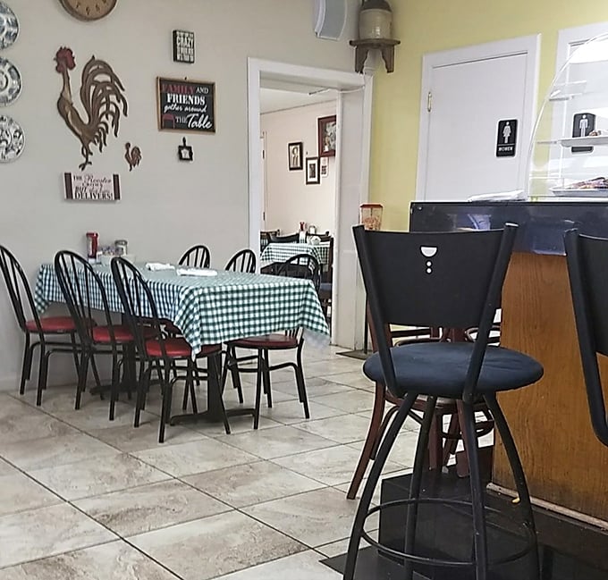 Classic checkered tablecloths and rooster decor create that "grandma's kitchen" vibe where calories don't count and second helpings are practically mandatory.