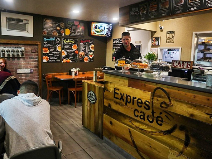 Inside, the rustic wooden counter and chalkboard menus create that perfect "I've discovered something special" atmosphere that makes neighborhood cafes truly magical.