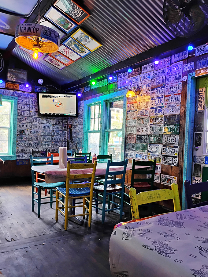 License plates from every corner of America create a patriotic patchwork that says, "People drive a long way for food this good." The mismatched chairs? Just part of the charm.