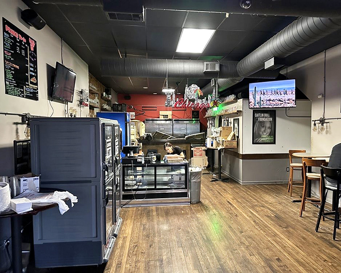 No-frills interior with wooden floors and exposed ductwork &ndash; Pequod's knows the real d&eacute;cor should be the pizza on your plate, not hanging on the walls.