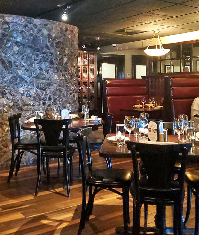 Stone walls and red leather booths create that perfect old-school steakhouse ambiance. Sinatra would feel right at home here.