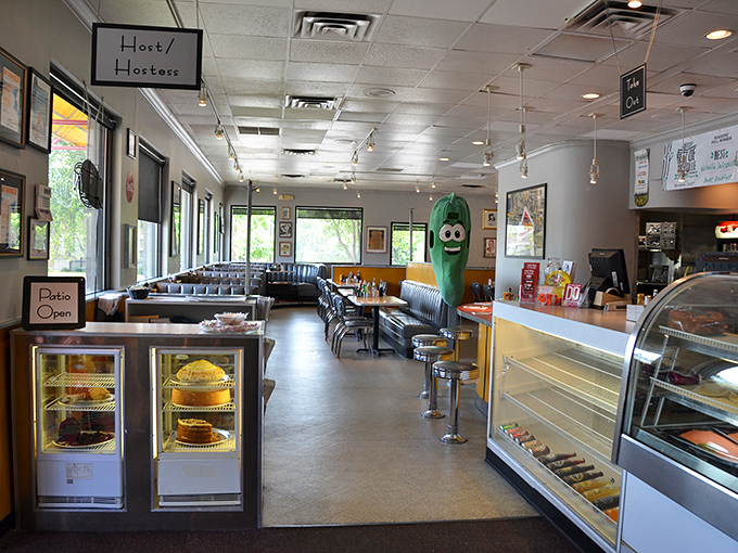 Step inside and you're greeted by the unofficial mascot&mdash;a giant pickle with a smile that says, "Trust me, the food here is worth every calorie."