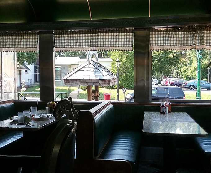 Vinyl booths and gingham curtains create the perfect backdrop for serious breakfast conversations and coffee refills.