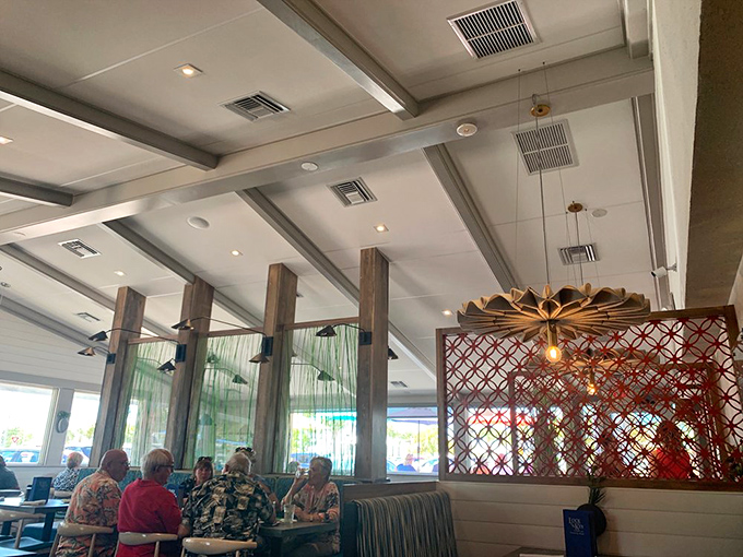 Inside, wooden beams and airy ceilings create that perfect "coastal casual" vibe where you can relax without feeling underdressed for dinner.