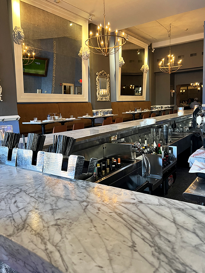 Elegance meets comfort in Forno's interior, where marble countertops and warm lighting create the perfect backdrop for memorable meals and conversations.