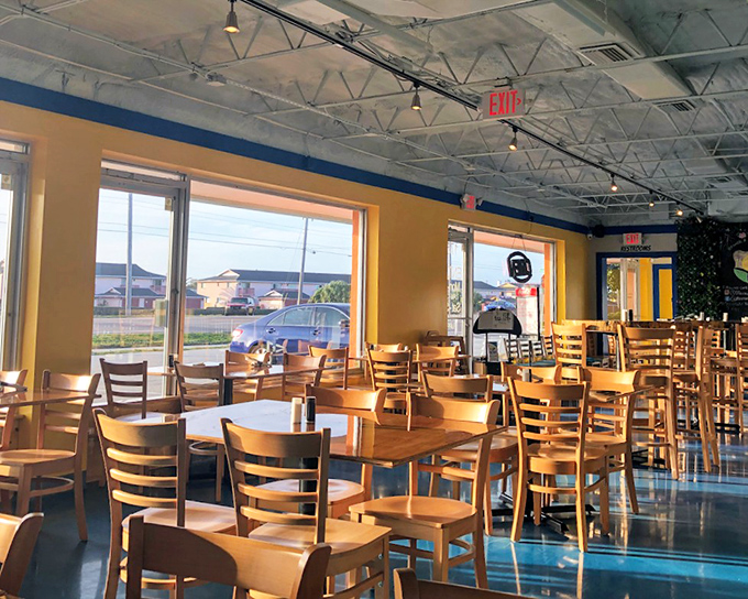 Sunshine streams through large windows, illuminating wooden tables where breakfast dreams come true. Simple, honest, and inviting.