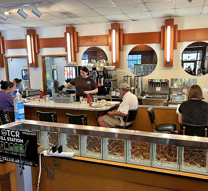 Where diner dreams come true! The classic counter seating at Elmo's offers front-row tickets to the breakfast ballet performed daily by skilled staff.