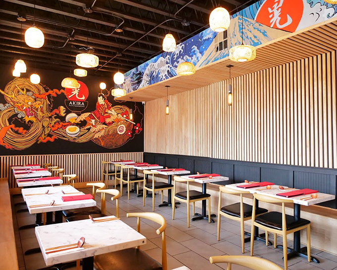 Modern minimalism meets traditional Japanese aesthetics in this dining space where the stunning mural tells you exactly what you're in for.