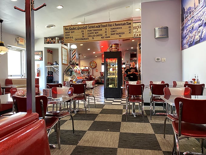 Classic red vinyl chairs and checkerboard floors transport you to a simpler time. This isn't retro by design&mdash;it's authentic diner magic that never went out of style.