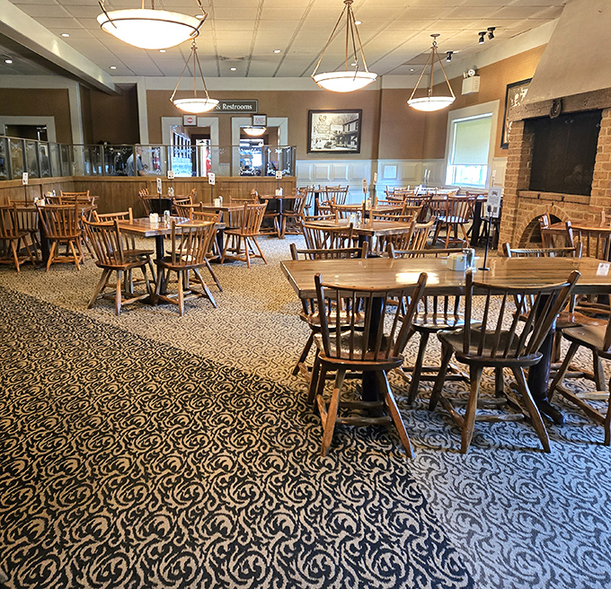 Wooden chairs and tables await hungry patrons like a Norman Rockwell painting come to life. This dining room has witnessed more food joy than a Thanksgiving reunion.