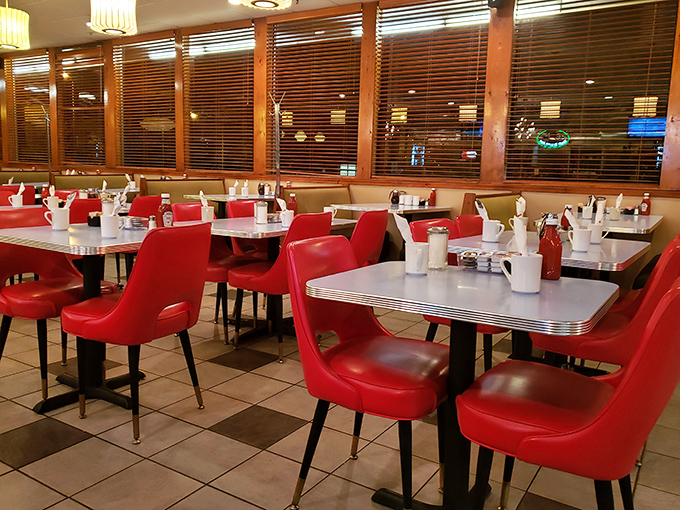 Step inside this retro wonderland where red vinyl chairs and checkered floors create the perfect diner atmosphere.