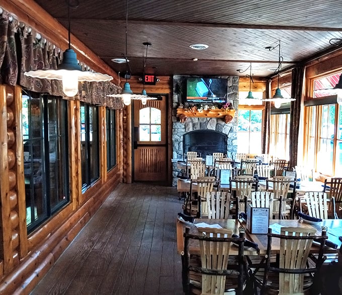 Wood-paneled walls and stone fireplace create the cozy atmosphere where dietary restrictions go to die happy deaths.